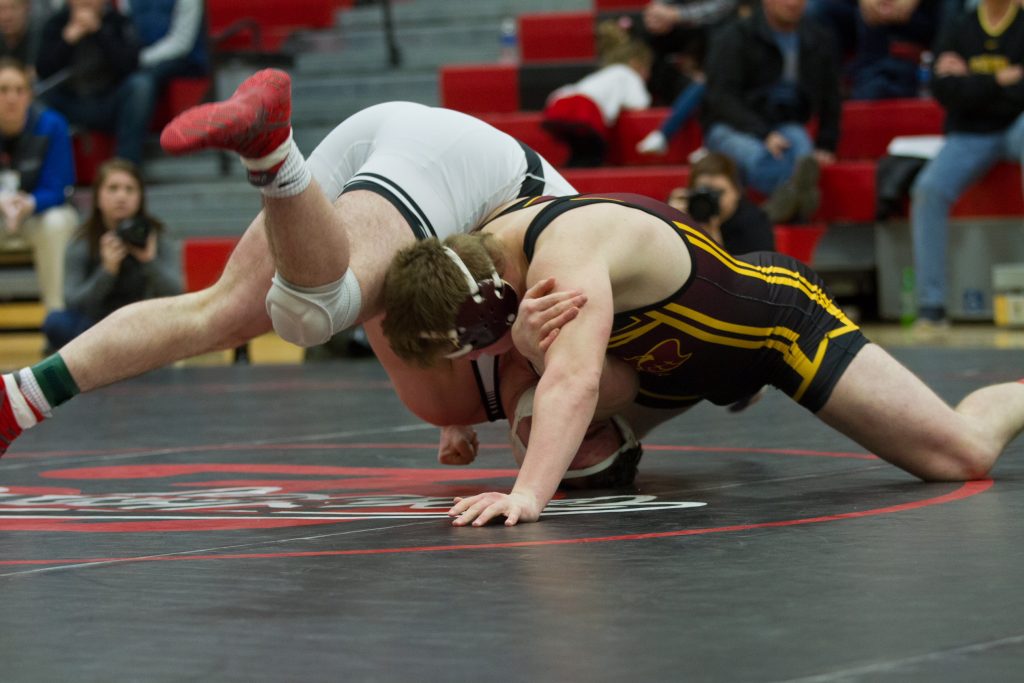 No. 1 Fort Dodge wrestlers ‘flex their muscle’ in victory over Hawks